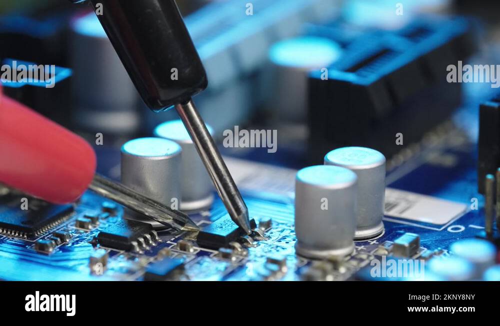 Using a multimeter to measure the electrical current in computer Stock ...