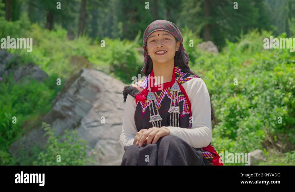 young cheerful Indian Asian village female wearing traditional attire ...