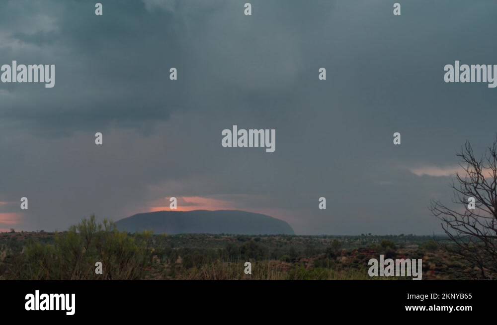 A time lapse of storm clouds rolling over Uluru in the Australian ...