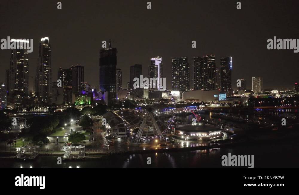 Skyviews Miami Observation Wheel and Bayfront Park at night. Aerial pan ...