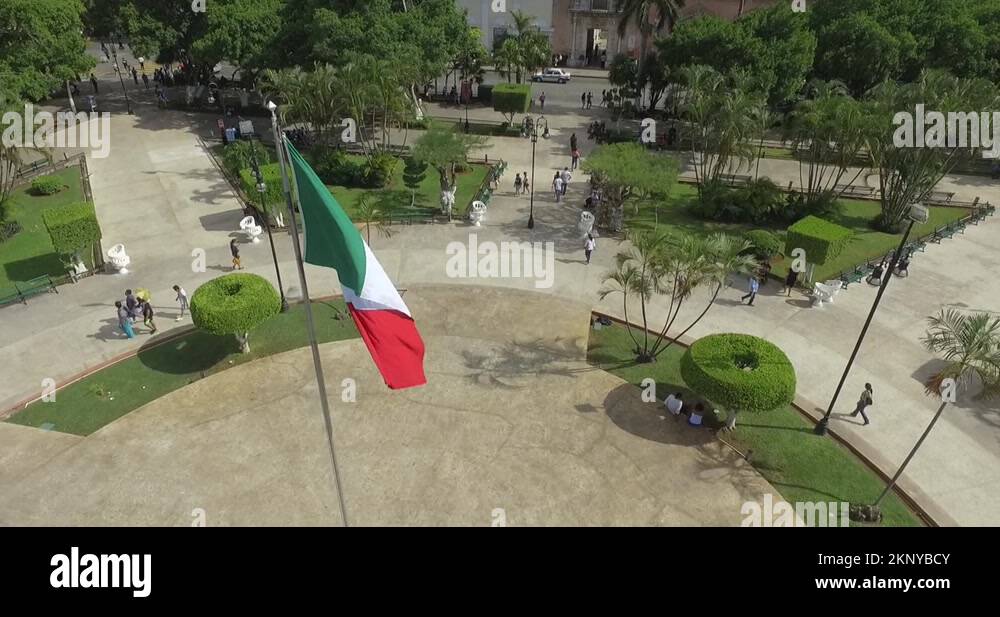 Alameda, plaza grande in Merida Yucatan Mexico, Mexican flag waving ...