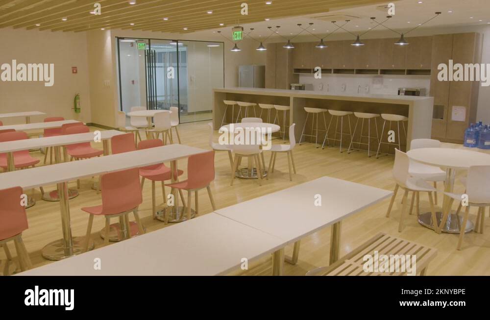 Panning Shot Of Empty Tables and Chairs Of A Clean And Modern Pantry ...