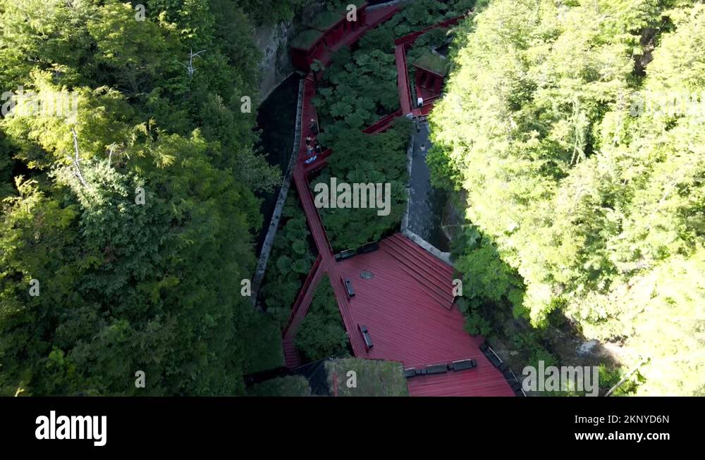 Aerial dolly out of runway and pools in Termas Geometricas hot spring ...
