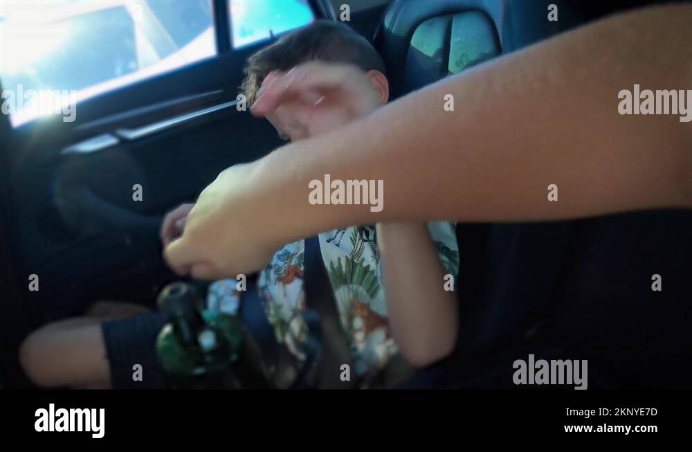 Two children pushing and bullying in the back seat of a car. Child ...