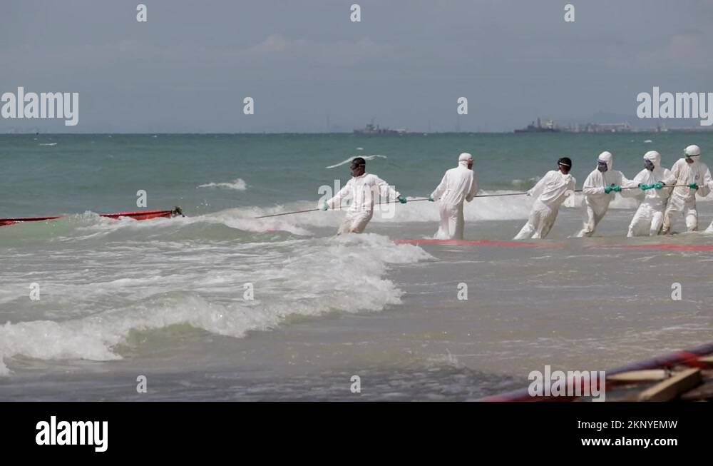 Navy In PPE Suit Pulling Together The Oil Boom Barrier To The Mae Ram ...