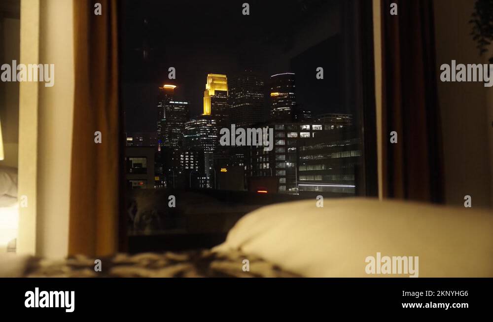 Minneapolis City Skyline at Night Through the Bedroom Window of a Condo ...