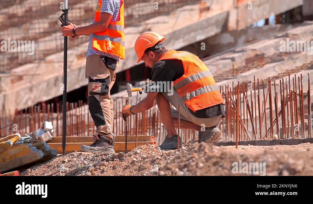 Building construction. Working process at a construction site. Builders ...