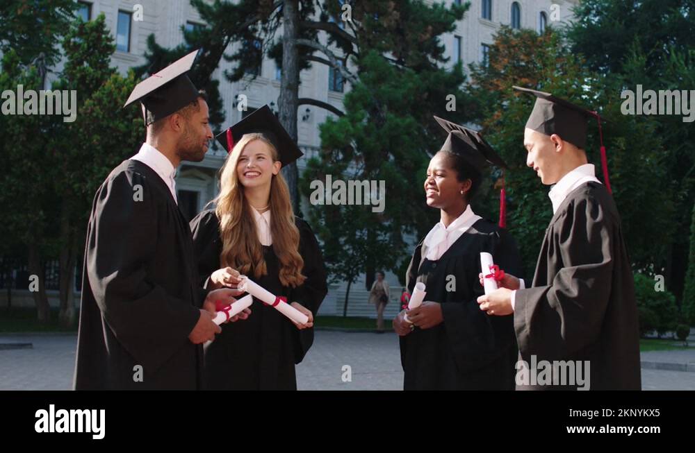 Graduation day in the college garden group of students graduates ...