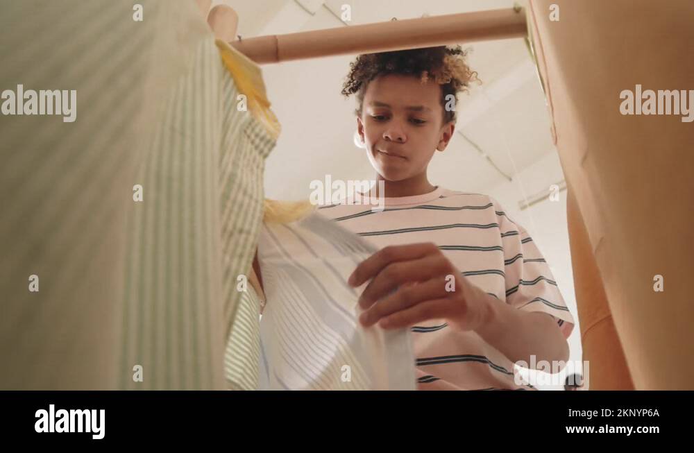 Boy choosing clothes Stock Videos & Footage - HD and 4K Video Clips - Alamy