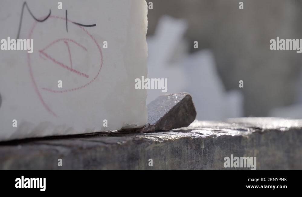 Worker Inserting Stone Wedge Under Heavy Makrana Marble Block In Open ...