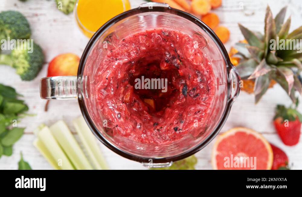 Super slow motion of mixing pieces of fruits in blender Stock Video ...