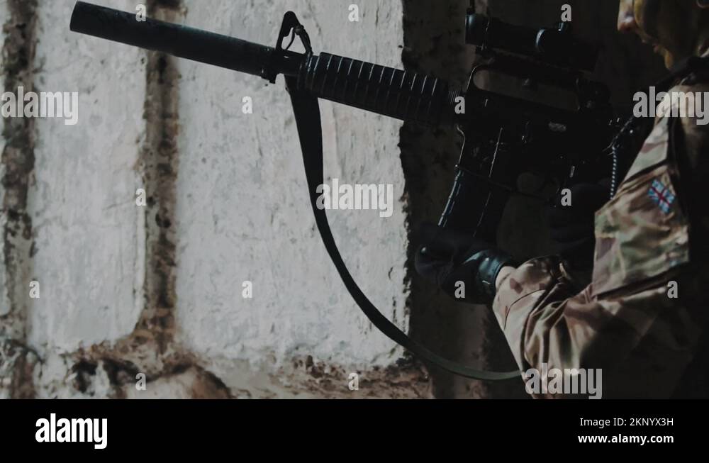 British ranger loading the magazine to M16 automatic rifle with ...