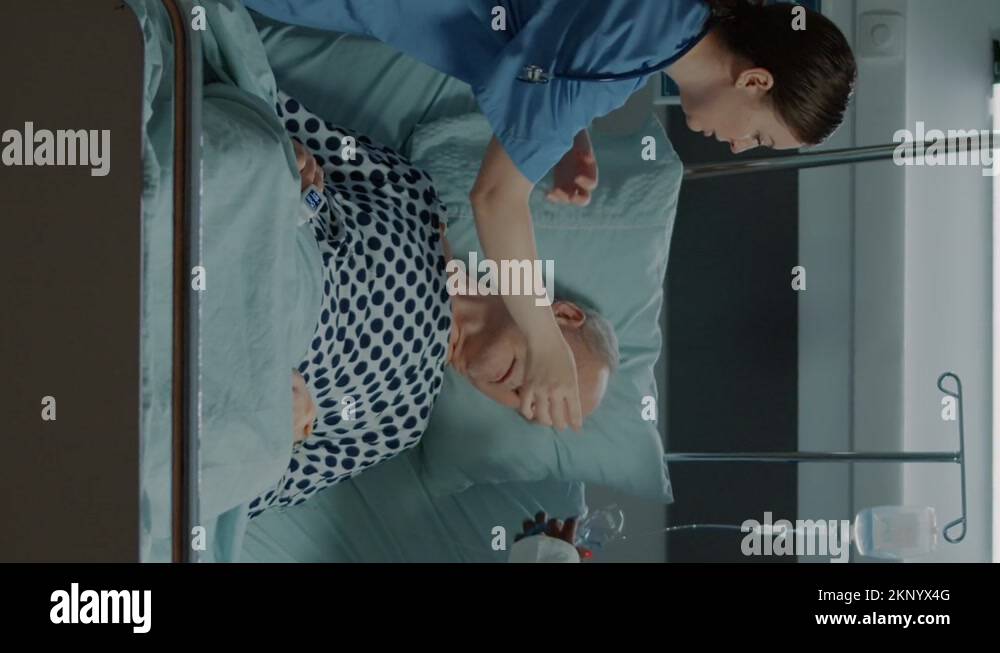 Vertical video: Patient going unconscious in hospital ward after ...