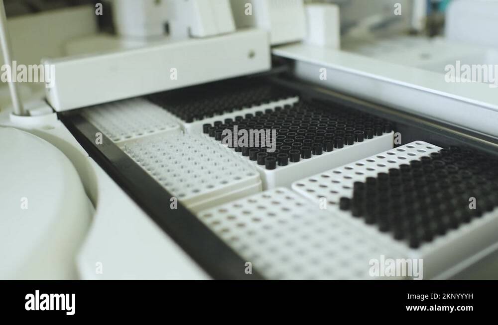 analyzer with containers with test tubes in close-up in a PCR ...