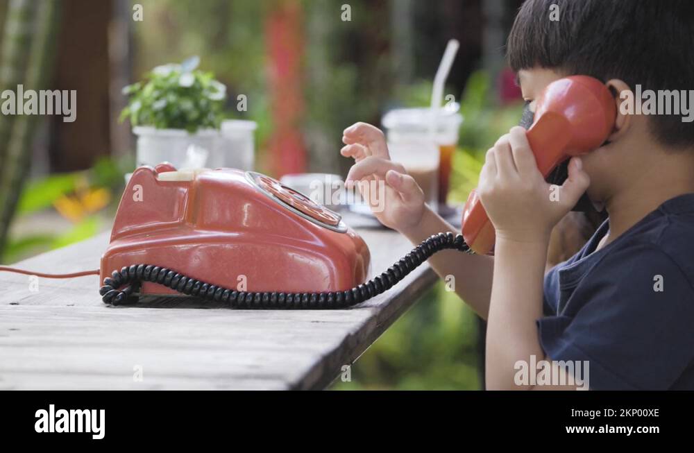 Kid hand using old rotary dial landline phone Stock Video Footage - Alamy