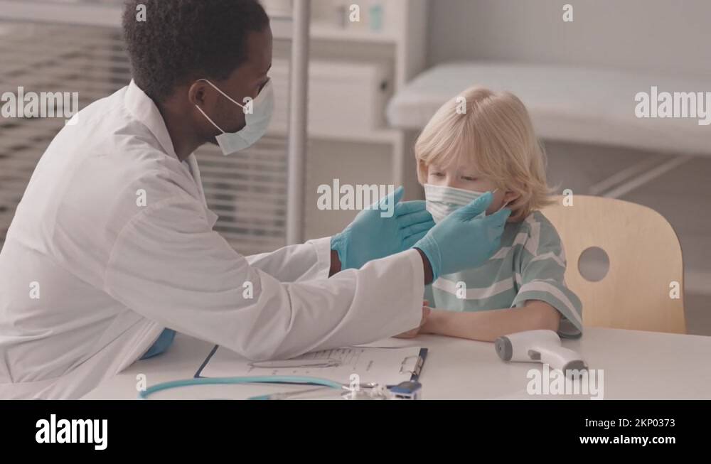 Doctor Examining Lymph Nodes of Little Boy Stock Video Footage - Alamy