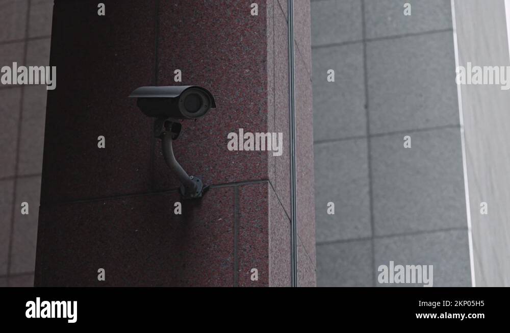 Cropped view of the security camera moving panning and tilting ...