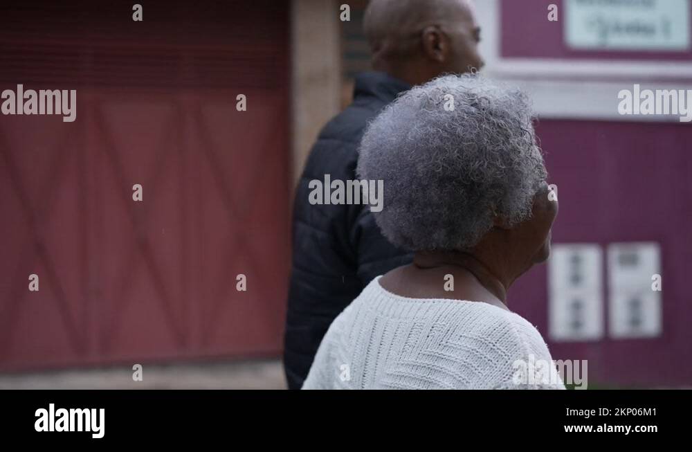 Generational relationship father and 80s mother walking together in ...