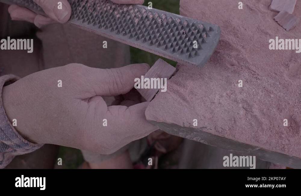 video of making souvenirs from stone, Hand filing stone, super close ...