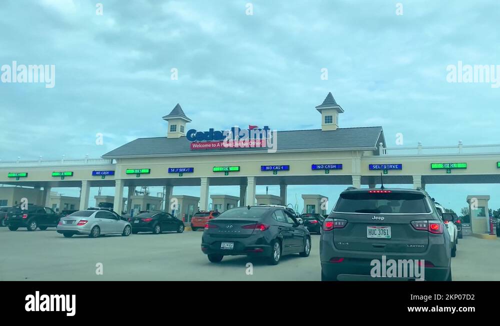 Vehicles entering the Cedar Point Amusement Park through the main gate ...