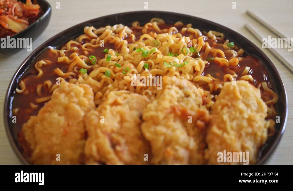 Korean instant noodles with fried chicken or Fried chicken ramyeon ...