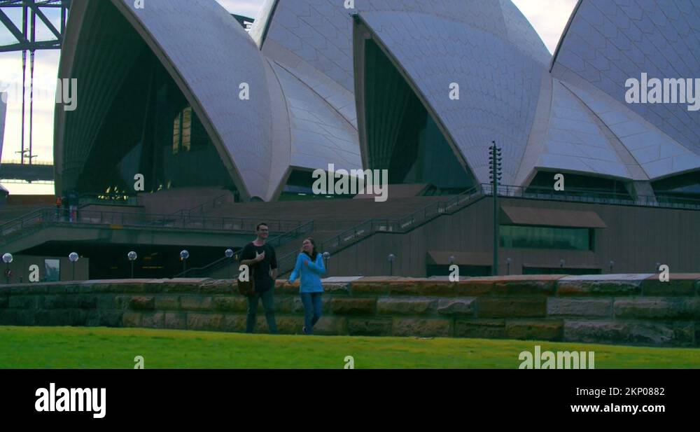 People Walking In The Street With Iconic Sydney Opera House In The ...