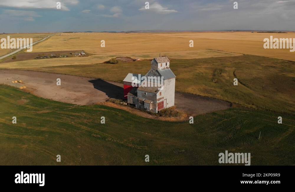 Drone backward moving shot taken of a grainery called Alberta Pacific ...
