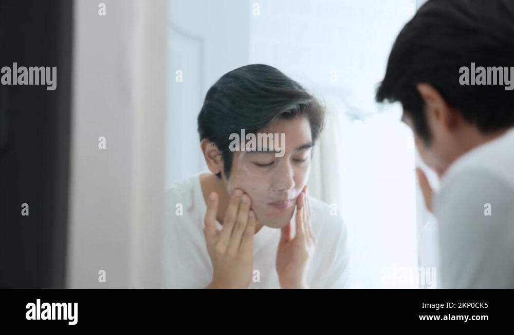 Health concept of 4k Resolution. Asian man washing his face with water ...