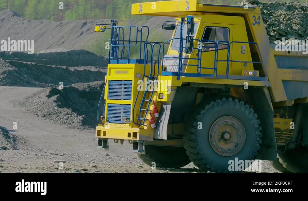 Dump Truck Equipment Transporting Mined Materials At Gold Excavation ...