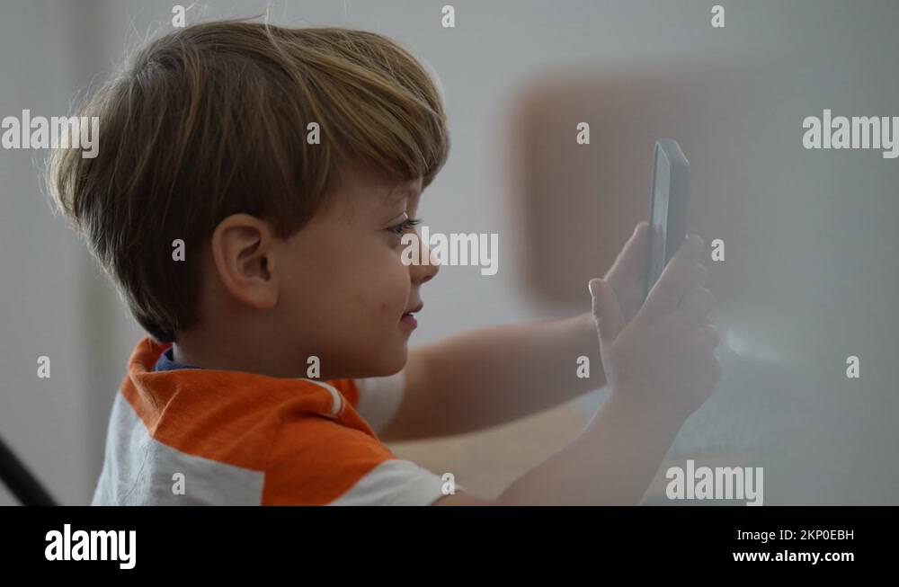 Kid using phone Stock Videos & Footage - HD and 4K Video Clips - Alamy