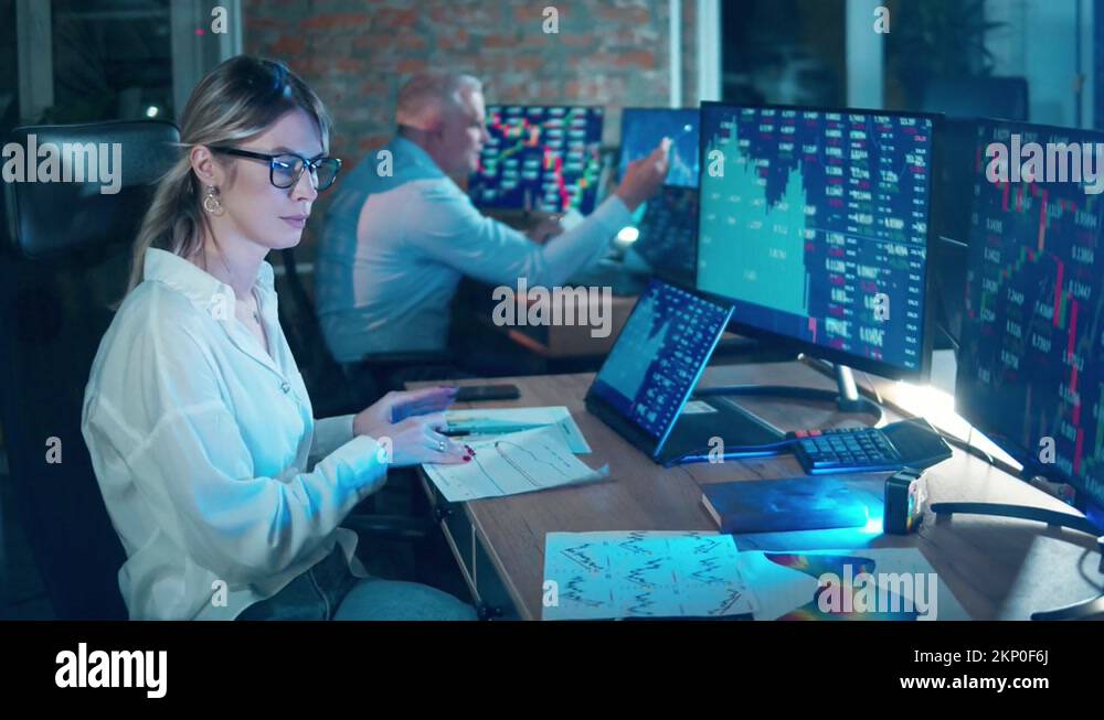 Female trader is monitoring stock rates in real-time Stock Video ...