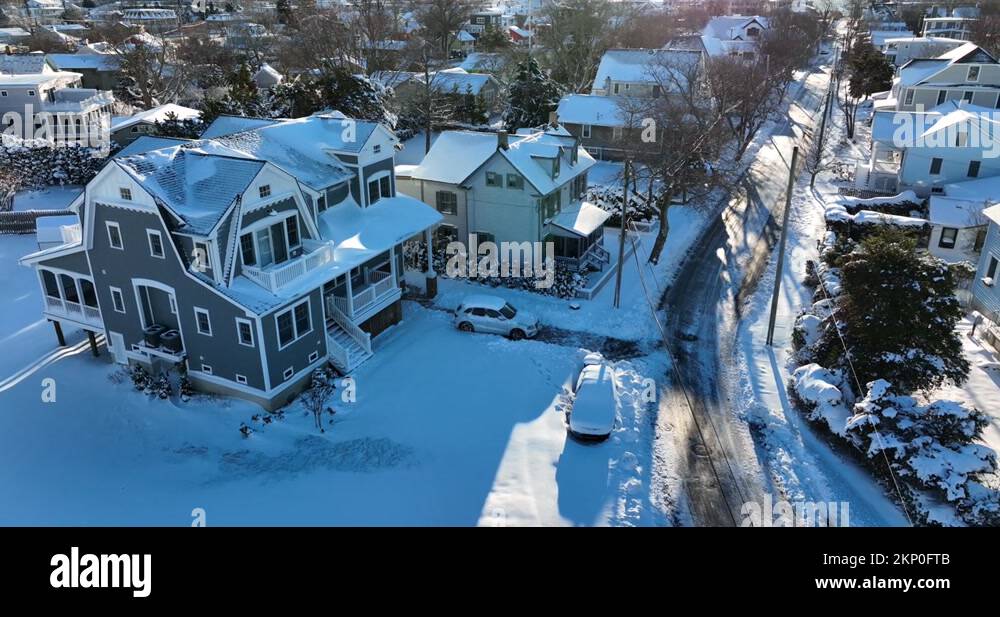 Snowfall in Small Town America. Fresh winter snow in USA. Cars snowed ...
