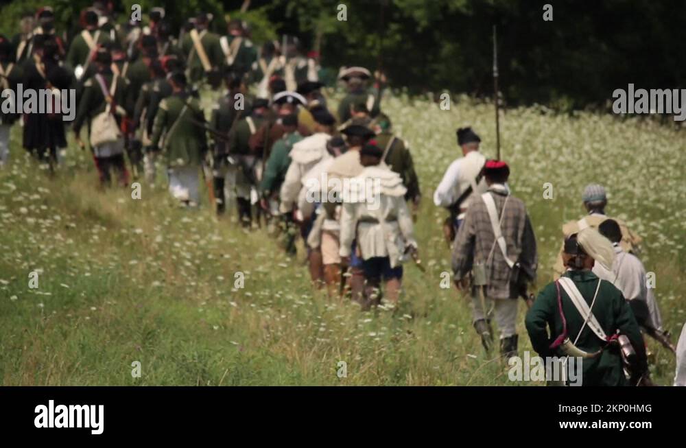 Uniformed Rev War Re-enactor Soldiers Marching with flintlocks Stock ...