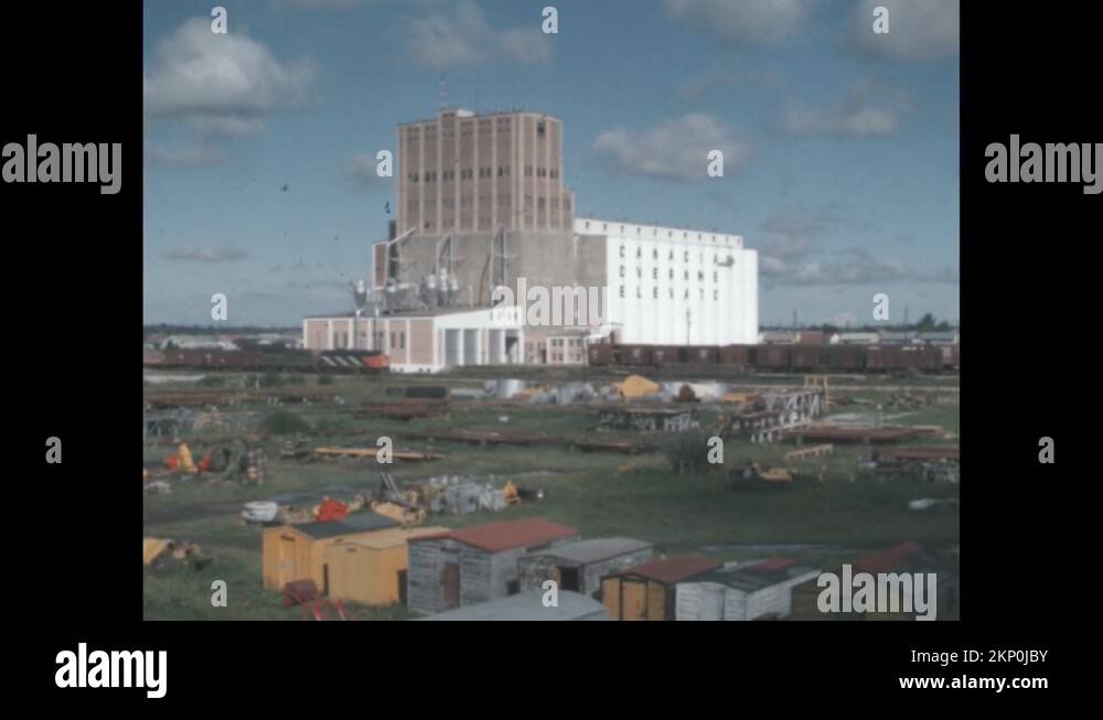 1960s: Huge grain elevator complex. Bungalow on a farm Stock Video ...