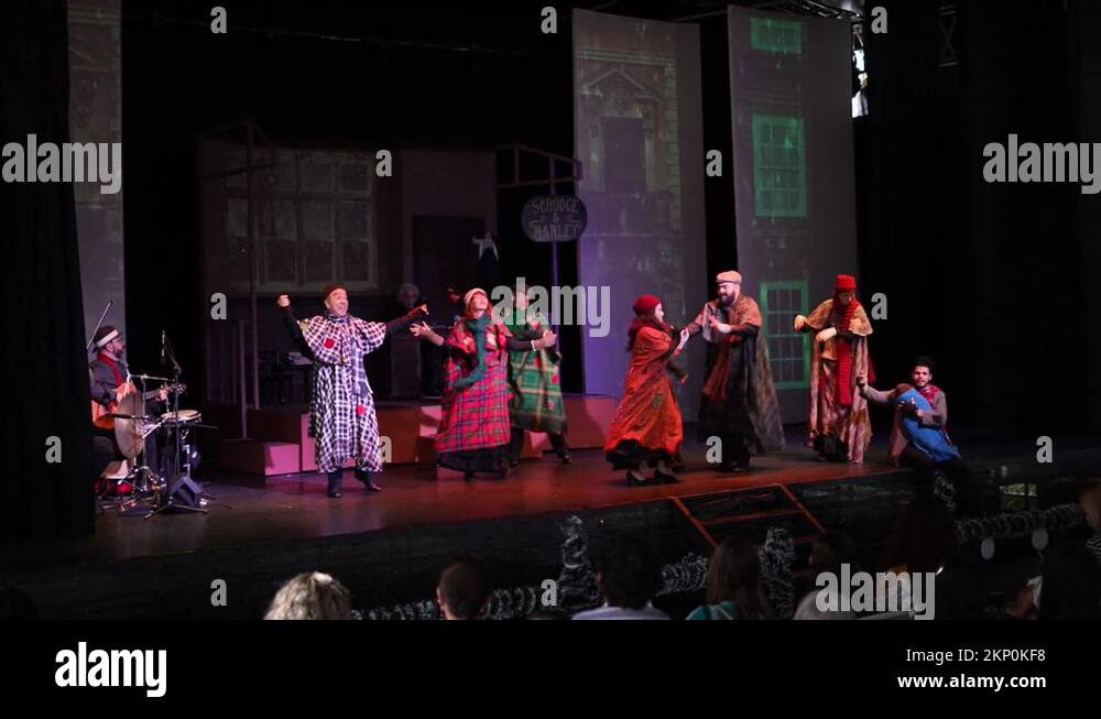 theater with audience, audience watching show actors on stage dancing ...