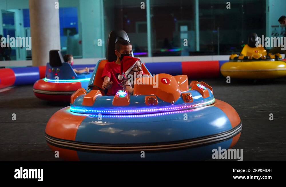 mechanical game with children playing, bumping into each other in play ...