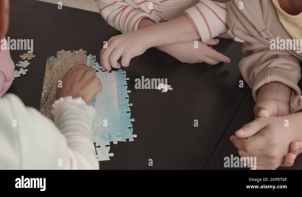 Group solving puzzle Stock Videos & Footage - HD and 4K Video Clips - Alamy