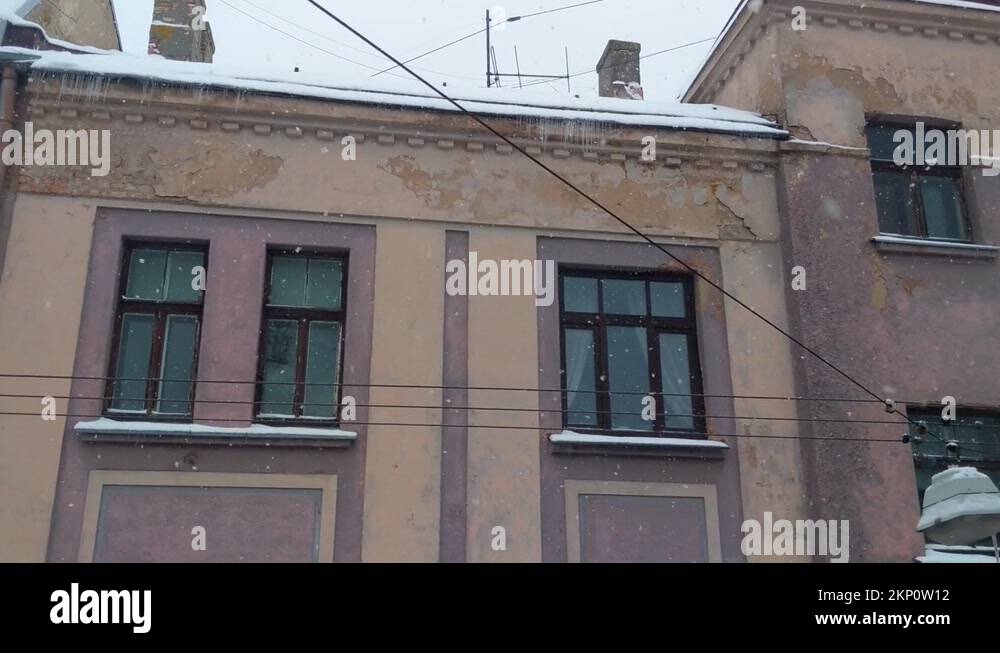 Looking through a window of snow falling on a freezing winter day with ...