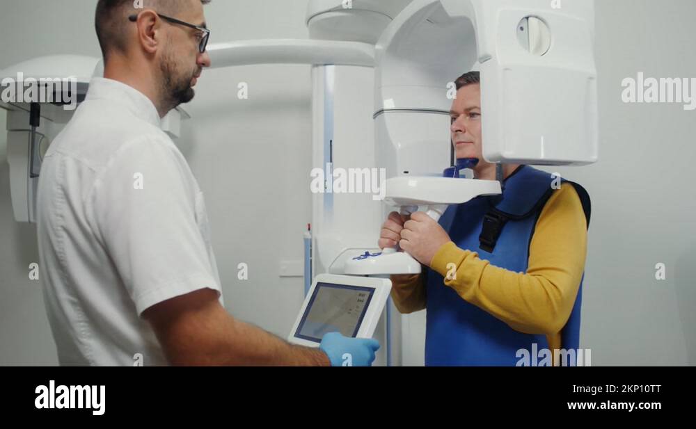Dental jaw scanning. Patient inside a panoramic 3D dental scanne Stock ...