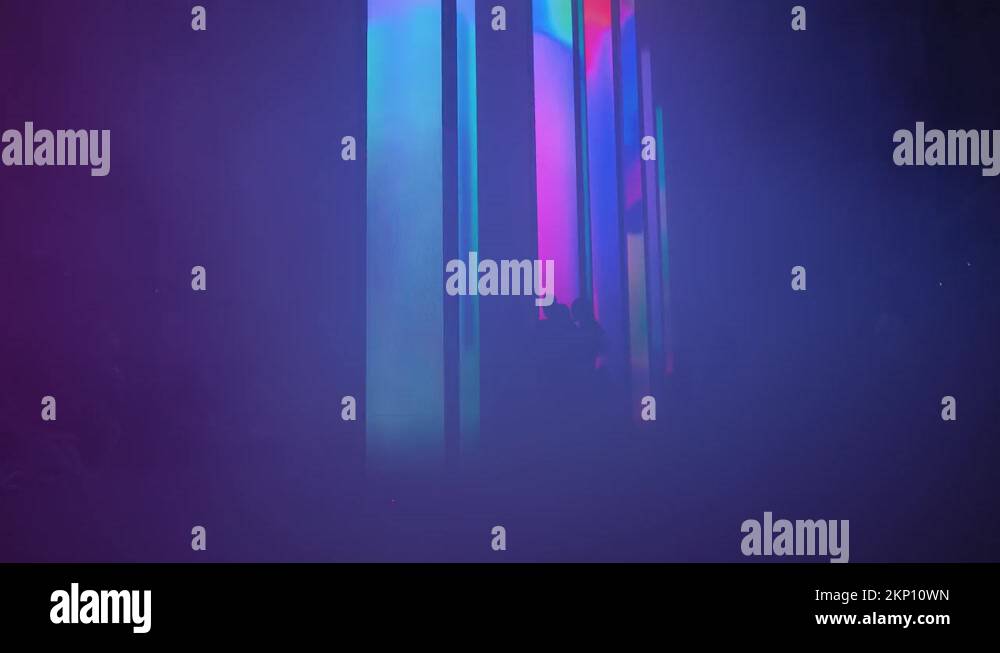 Colorful interactive LED wall show on columns in dark room - digital ...
