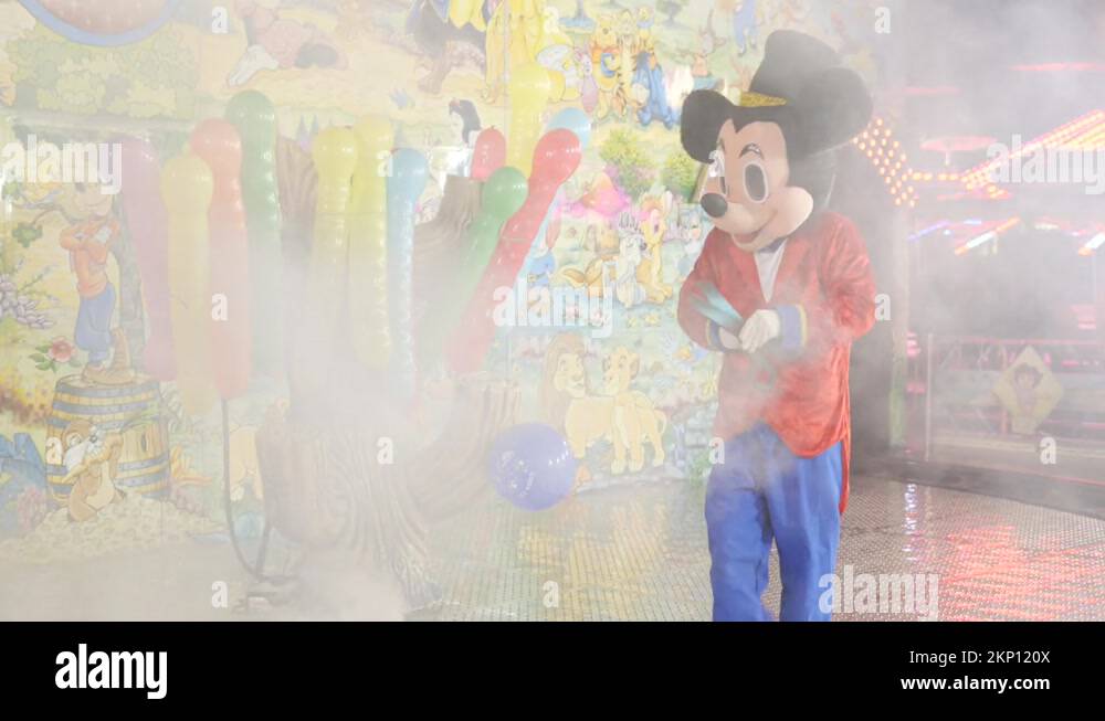 Valencia funfair - Man in Mickey Mouse costume cheering up people Stock ...