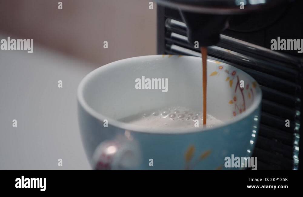 Coffee espresso dripping into glass cup slow motion 4k 30p Stock Video ...