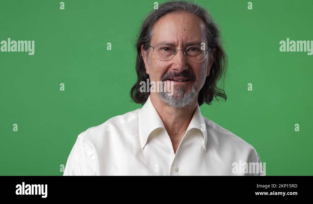 Portrait of mature man smiling happy face on green screen chroma key ...