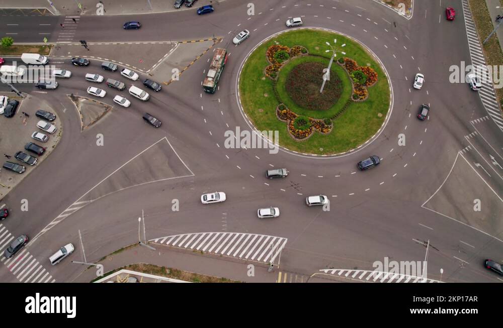 Traffic circle with many cars. Top down aerial view on a circular ...