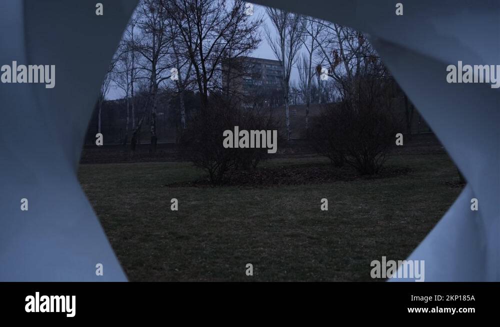 Zoom out dark building in abstract white form in winter time on Ukraine ...