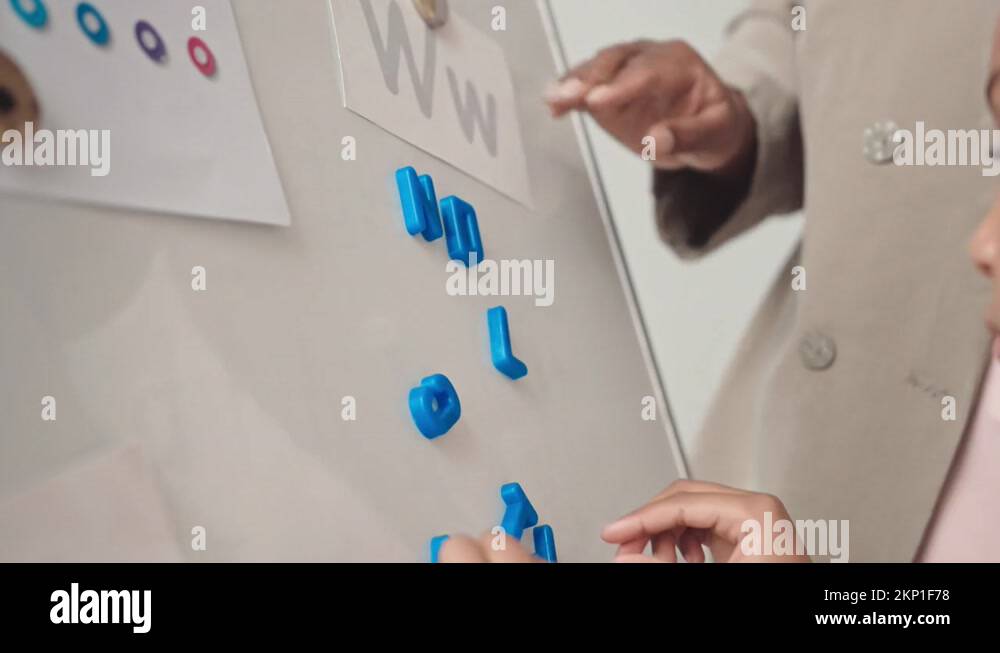 Little Girl Using Letter Magnets in Classroom Stock Video Footage - Alamy