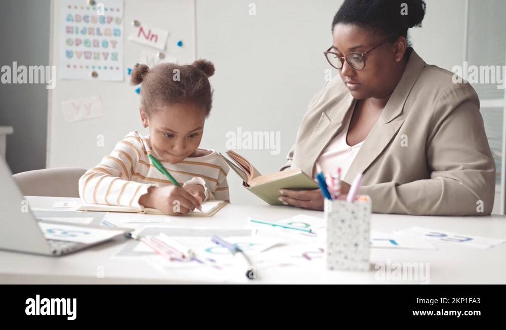 Preschool Girl Learning Letters of Alphabet with Teacher Stock Video ...
