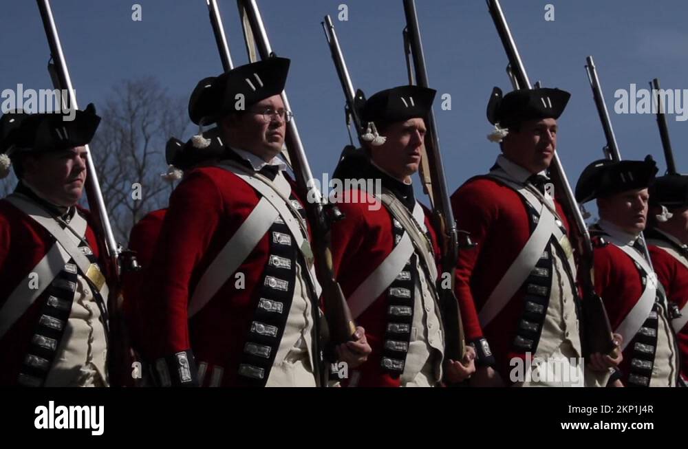 British Redcoat Re-enactor Soldiers armed with flintlock muskets, March ...