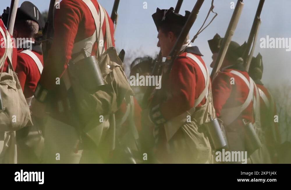 British Redcoat Re-enactor Soldiers armed with flintlock muskets, March ...