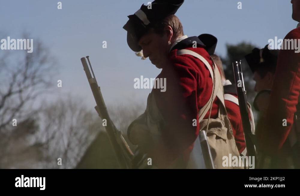 British Redcoat Re-enactor Soldiers armed with flintlock muskets, March ...